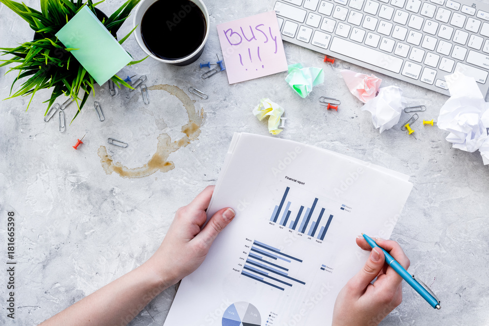 Chaos in office.Desk covered with crumpled paper and scattered ...