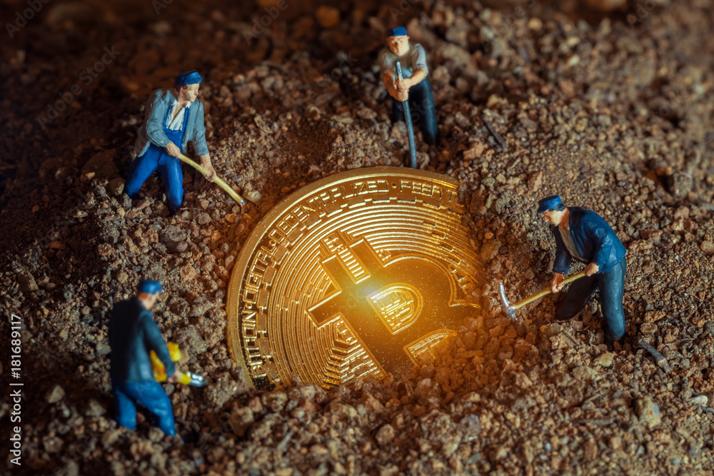 macro miner figurines digging ground to uncover big shiny bitcoin Stock ...
