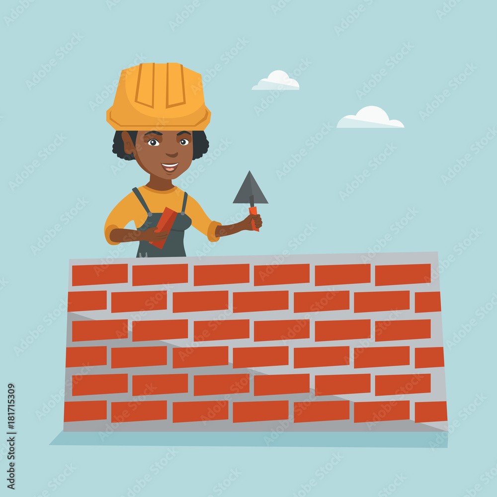 African-american bicklayer working with spatula at the construction ...