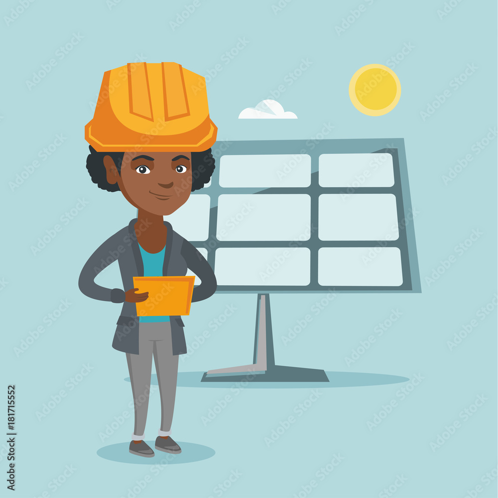 African engineer in hard hat working on a digital tablet at solar power ...