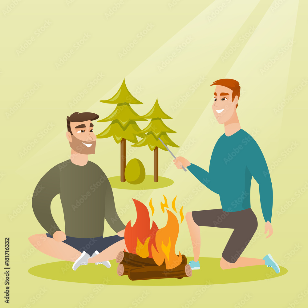 Two caucasian white happy friends sitting near bonfire in the camping ...