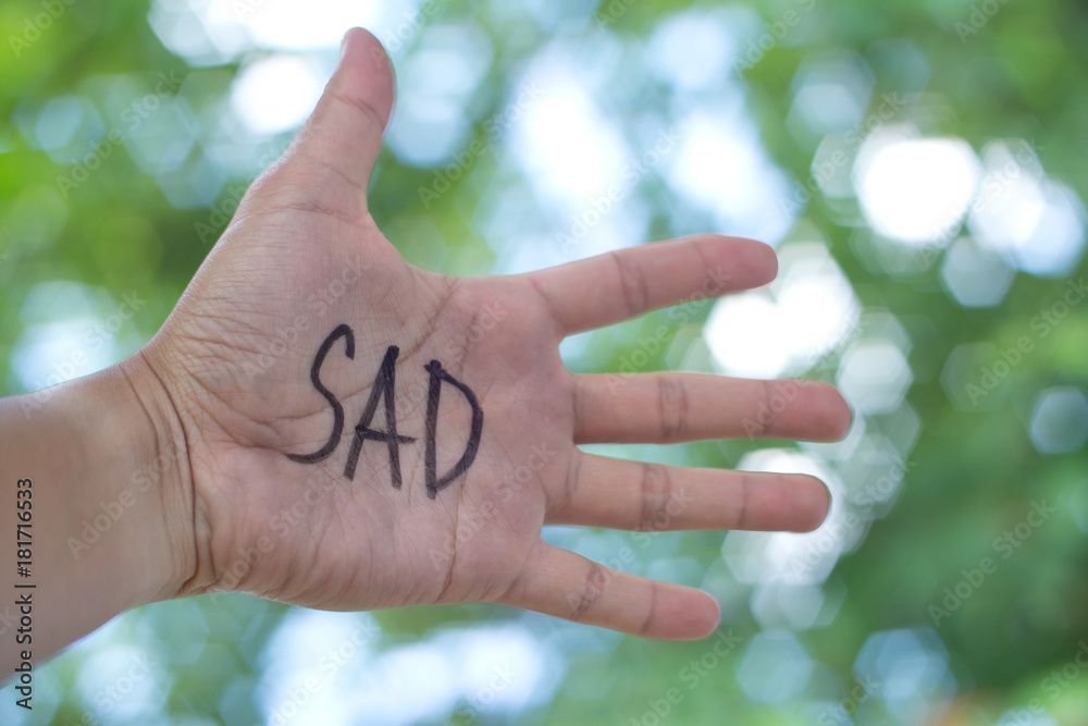 Concept Photo Of A Handwriting Word "SAD" On The Left Hand With Blurry ...