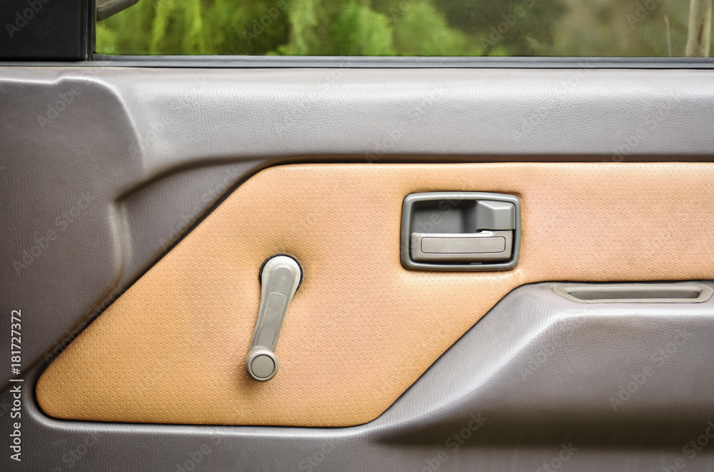 Refinishing inside of car door panel in beige color and equipped with ...