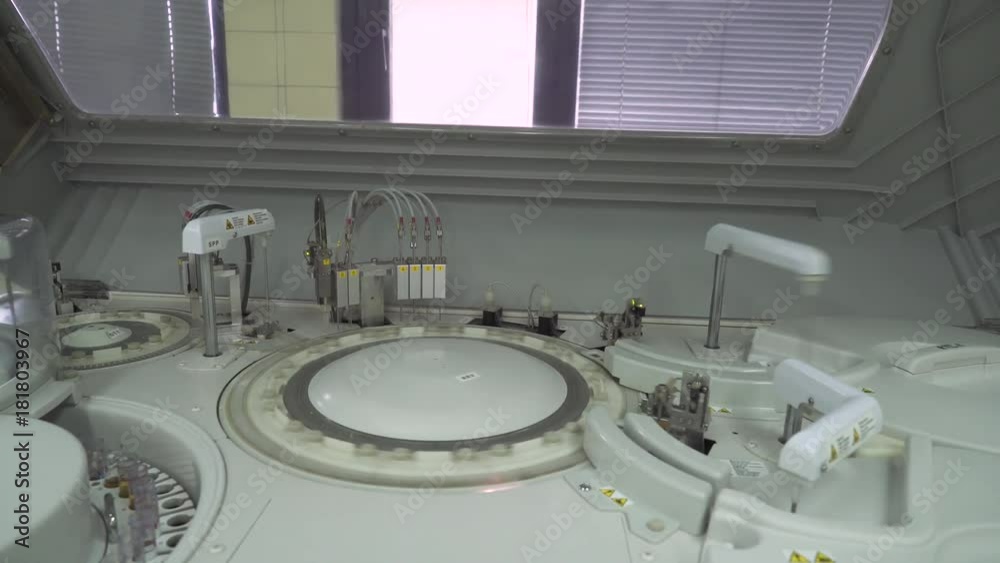 Automation, robotic machine analysis types samples in test tubes ...