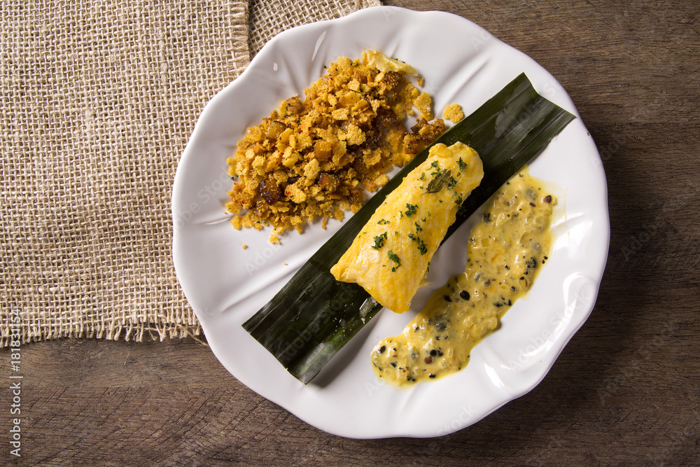 Fried fish with farofa and passion fruit sauce - Traditional amazonian ...