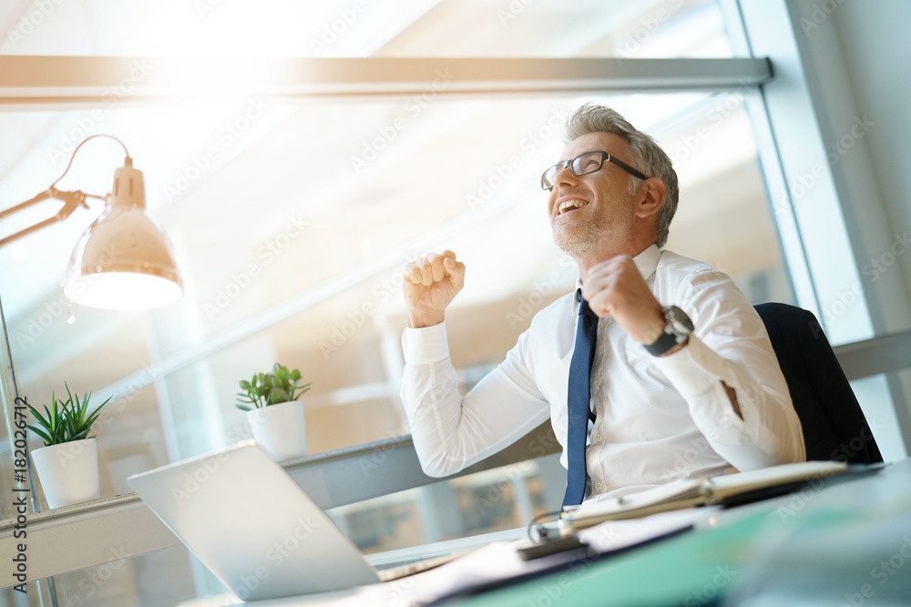 Happy businessman having a good day Stock Photo | Adobe Stock