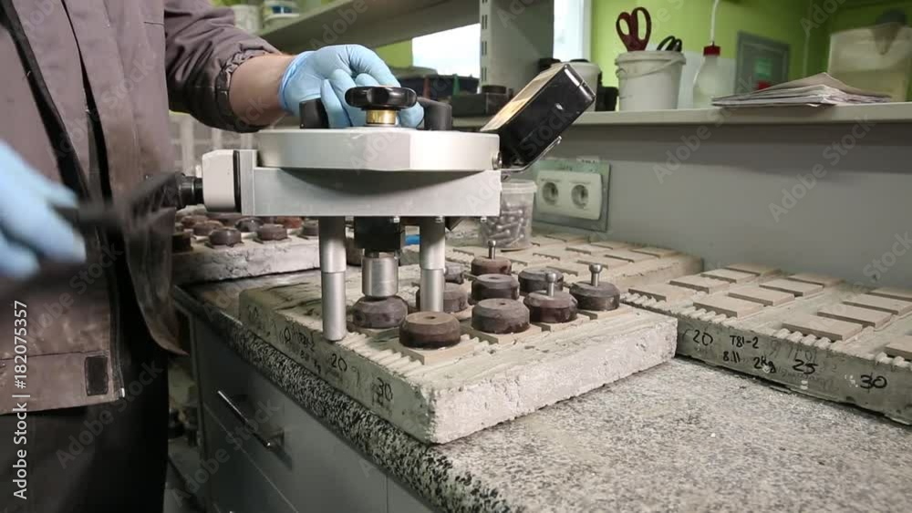 Wideo Stock: Testing of polymer glue for ceramic tiles. Laboratory ...