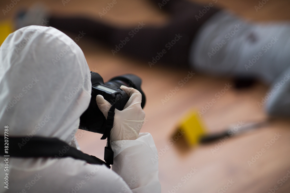 criminalist photographing dead body at crime scene Stock Photo | Adobe ...