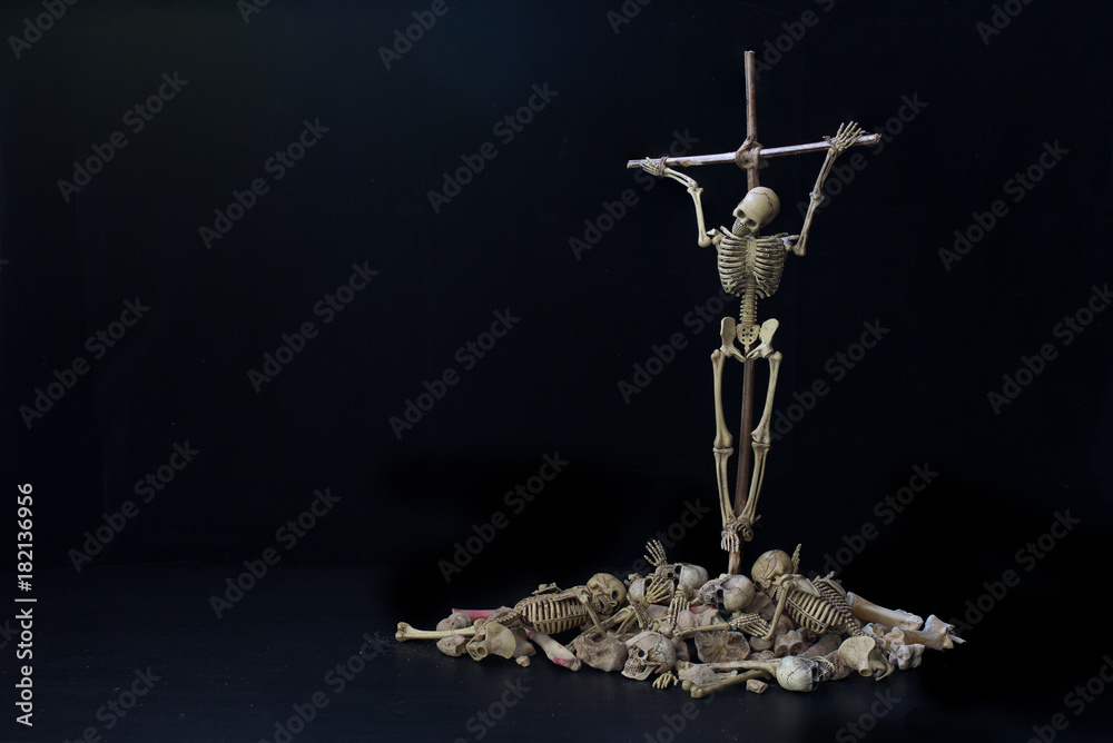 Crucifixion wooden skeleton top on pile of bone by god of death because ...