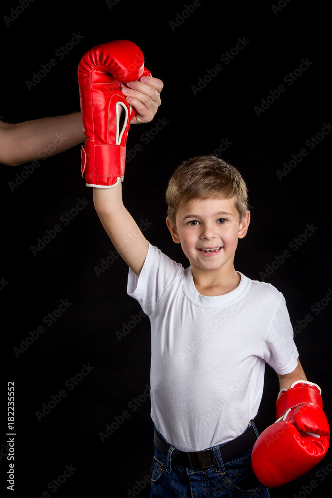 The little winner. Extremely happy little boxer with right hand up in ...