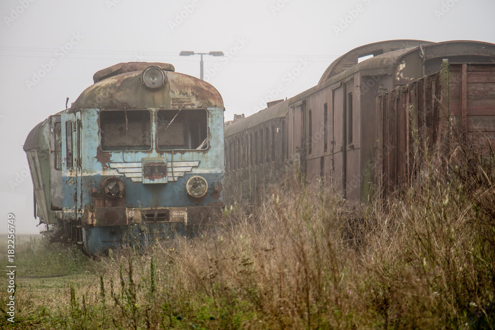 Old rusty trains. Old abandoned track, siding with dirty old trains ...