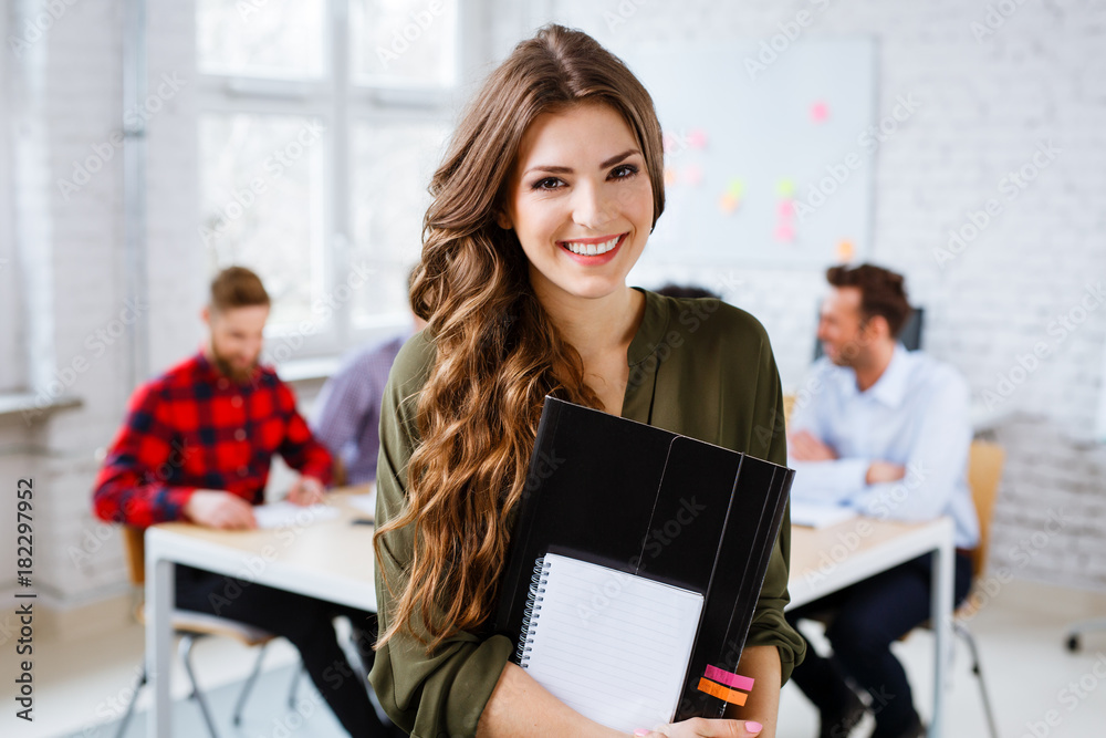 Portrait of happy female student at university Stock Photo | Adobe Stock
