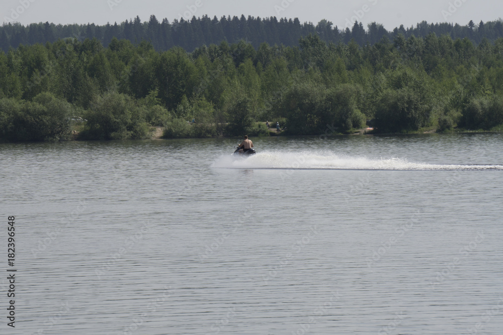 Young guy cruising on the atlantic ocean on a jet ski Stock Photo ...