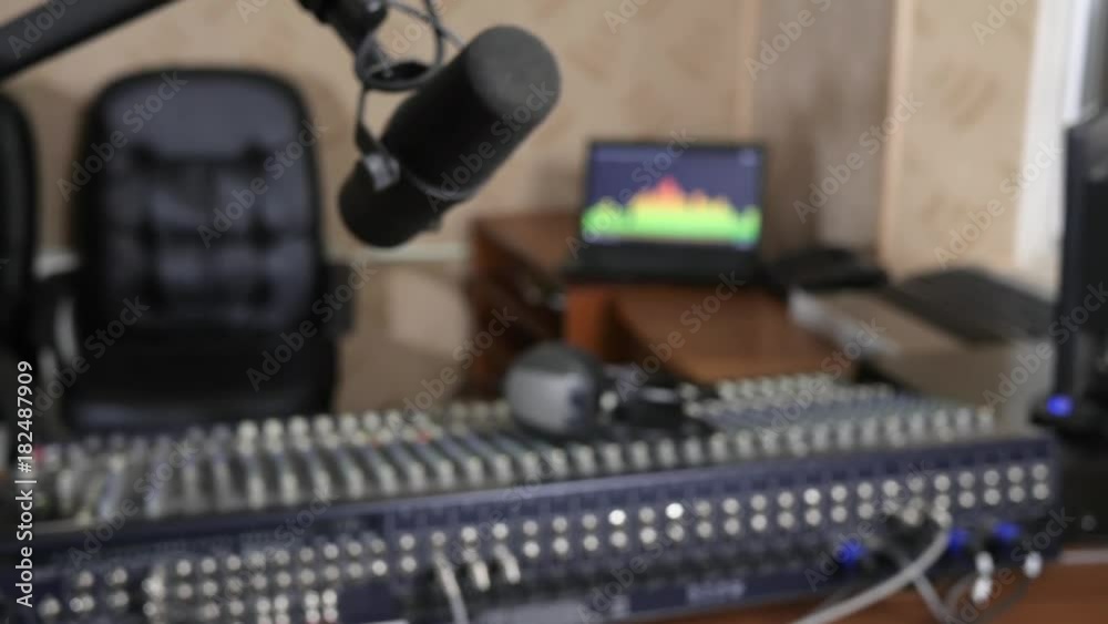 professional microphone in recording studio on background of audio ...