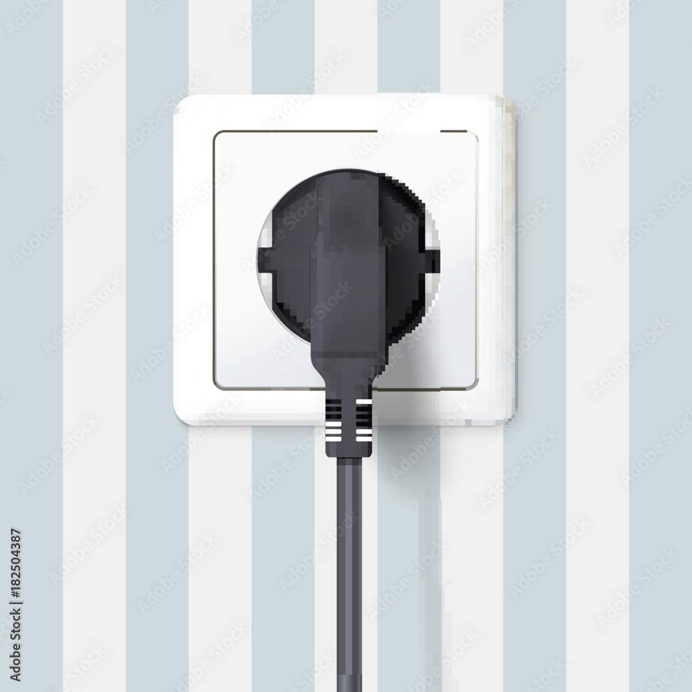 Black plug inserted in a wall socket on backdrop of wall with wallpaper ...