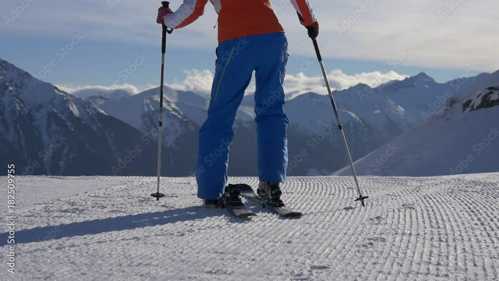 Woman putting on skis and leaves Stock ビデオ | Adobe Stock