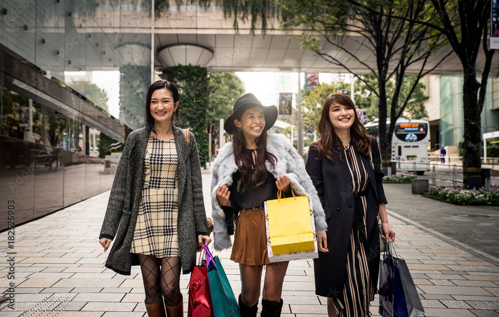 Group of japanese women spending time in Tokyo, making shopping in ...