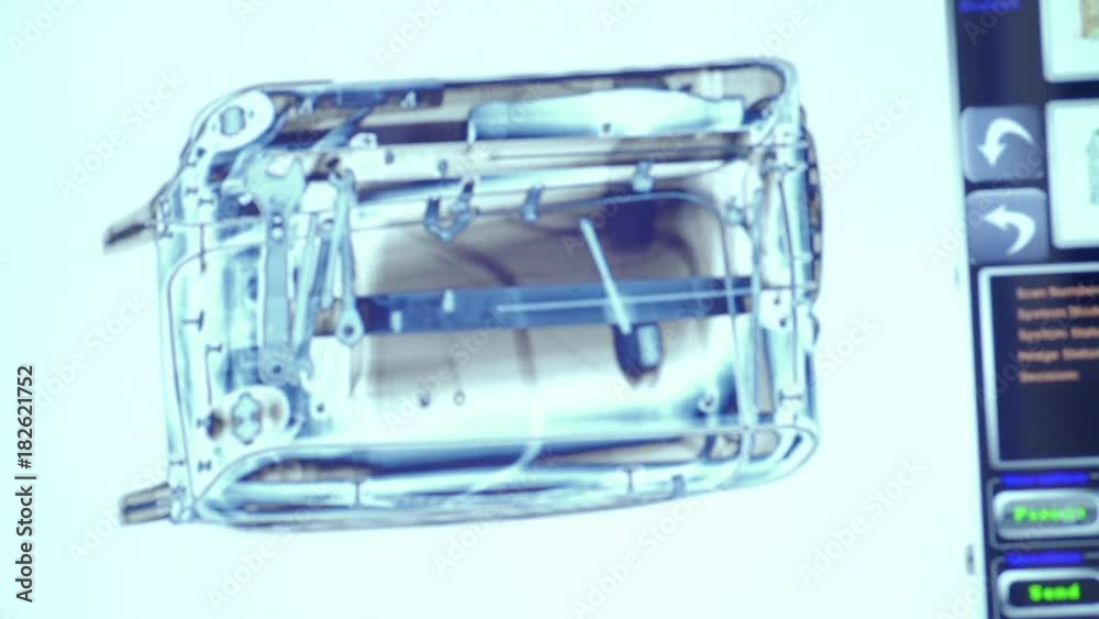 Baggage is scanned in x-ray scanner. Operator change the modes of the ...