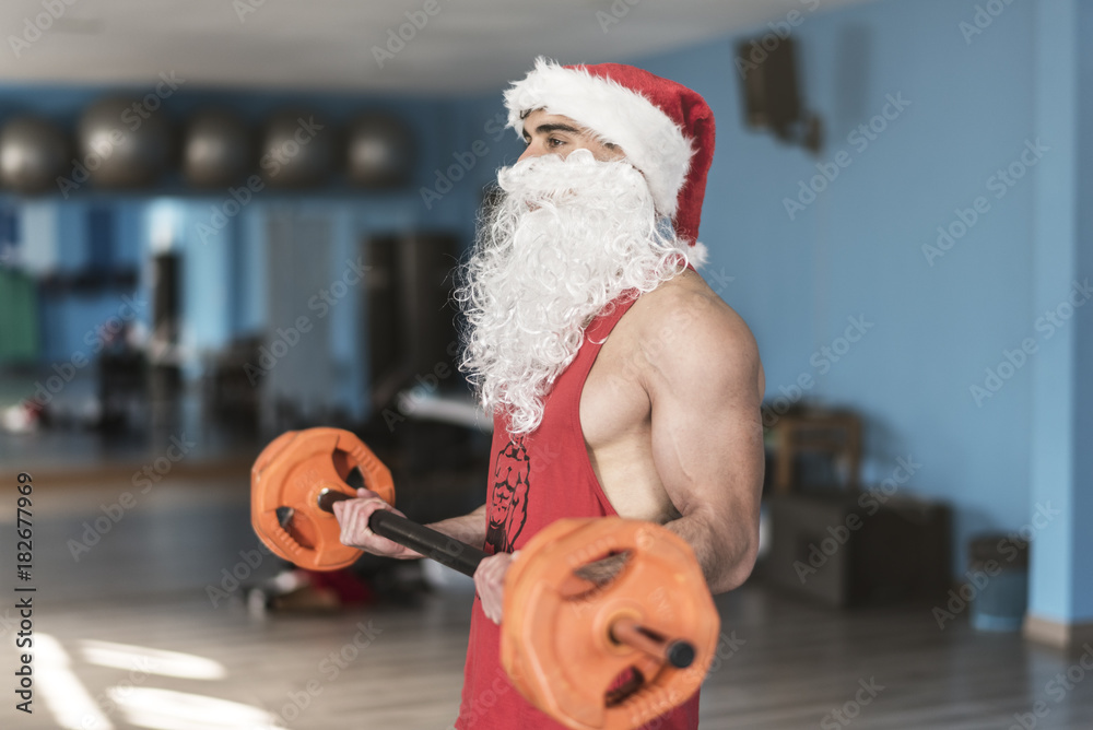 Santa Claus training in gym lifting weights Stock Photo | Adobe Stock