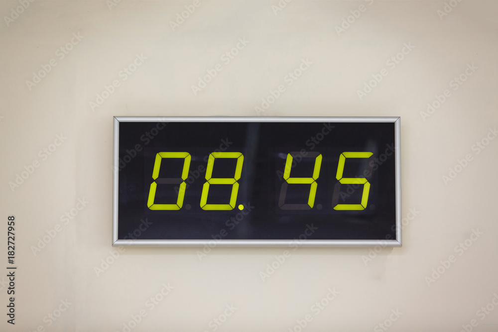 Black digital clock on a white background showing time Stock Photo ...