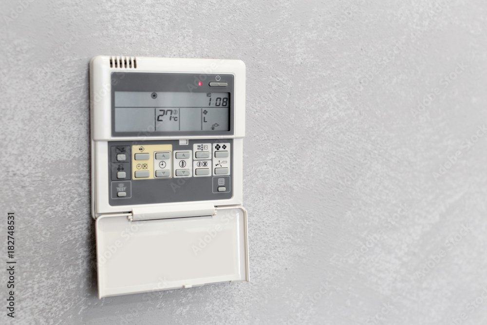 Air Conditioner Remote Control in a hotel room Stock Photo | Adobe Stock