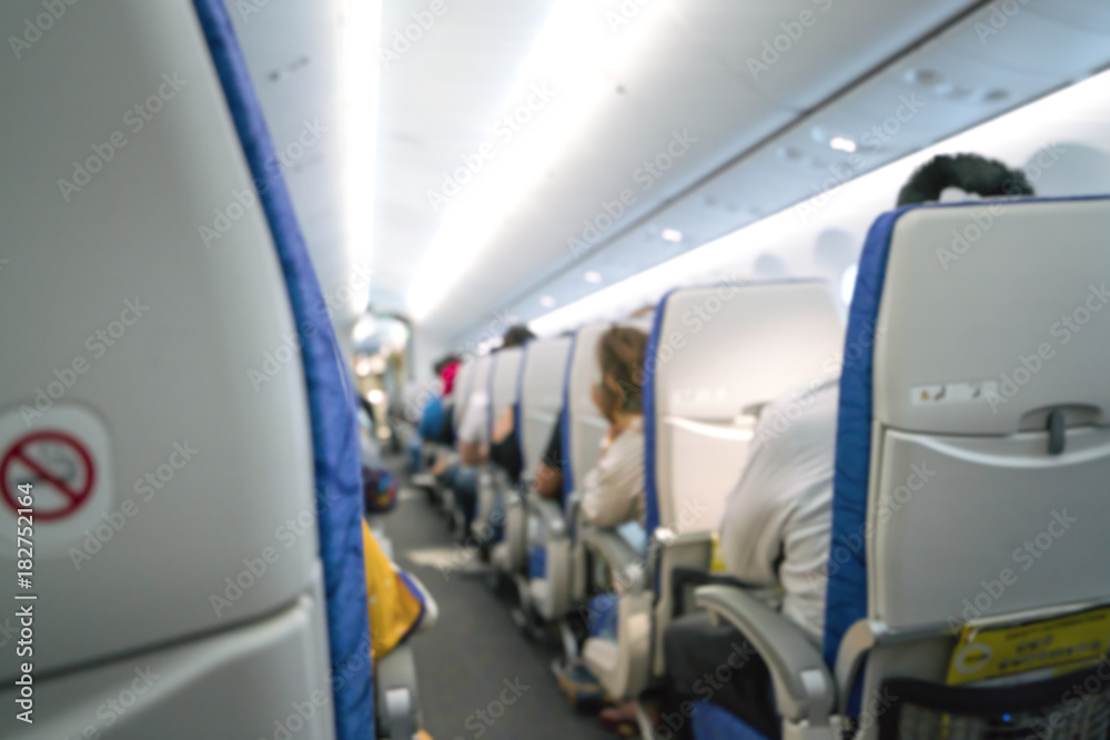 Inside airplane interior - people sitting on seats Stock Photo | Adobe ...