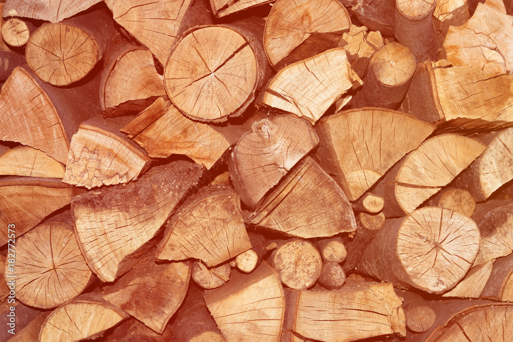 chopped log logs stacked in a drow log close-up as a background or ...