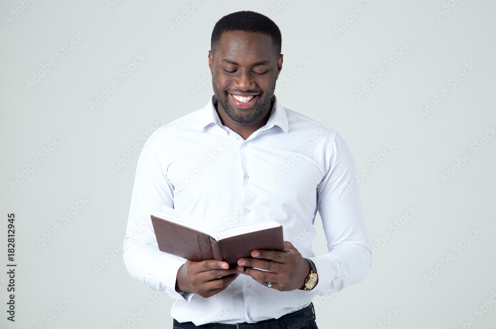 Happy man reading book. Smiley face. Stock Photo | Adobe Stock Happy man reading book. Smiley face. Stock Photo | Adobe Stock