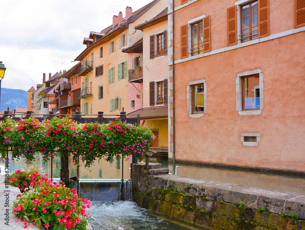 The city of Annecy. Historical medieval houses, the Chiu channel and a ...