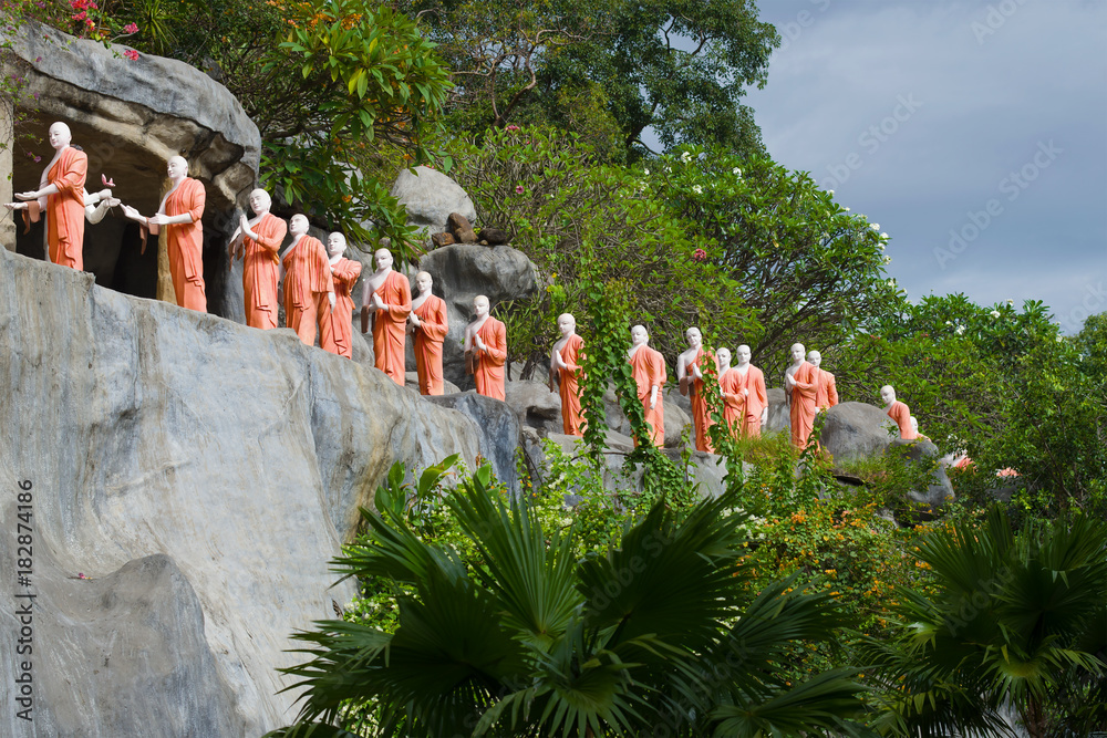 Procession of Buddhist monks. Sculptural composition in the territory ...
