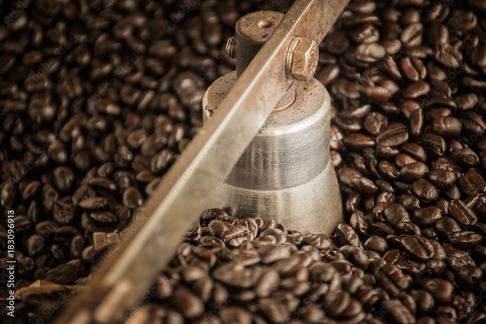 Coffee beans during the roasting process, moving paddle of the ...