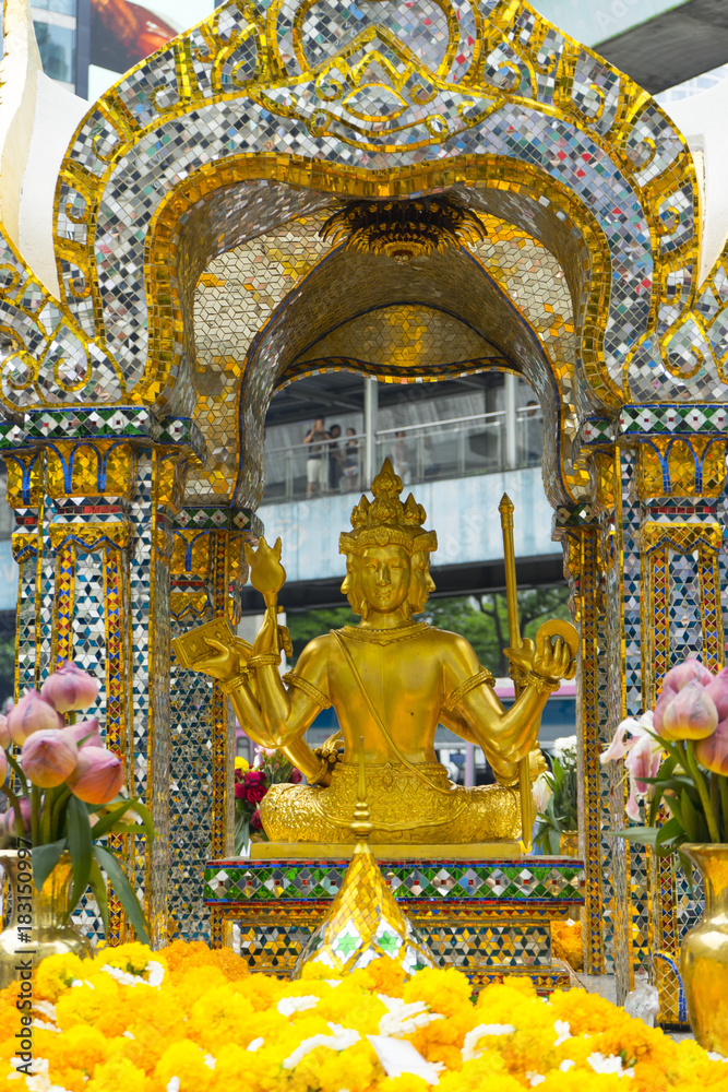 The Golden four-faced Brahma Shrine Phra Phrom at Erawan Temple in ...