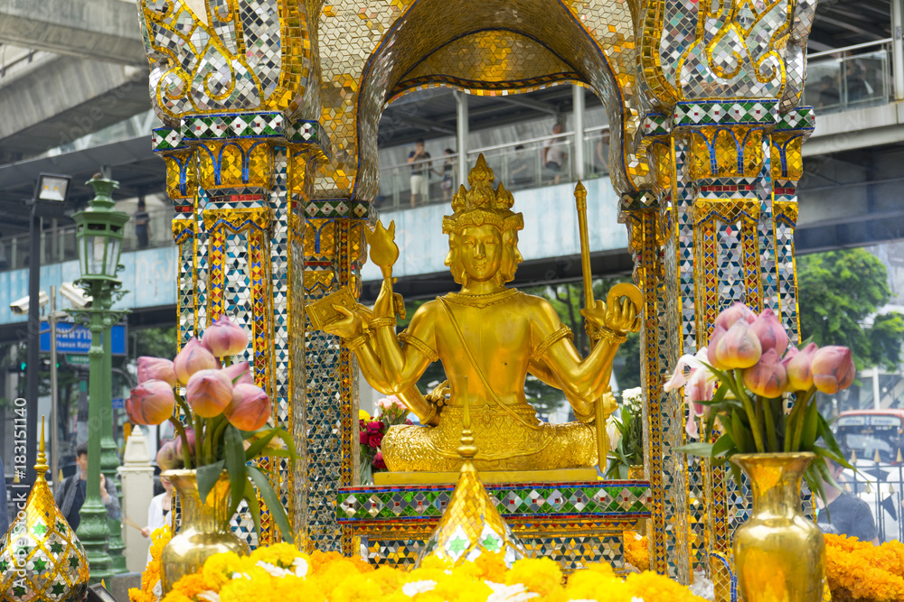 The Golden four-faced Brahma Shrine Phra Phrom at Erawan Temple in ...