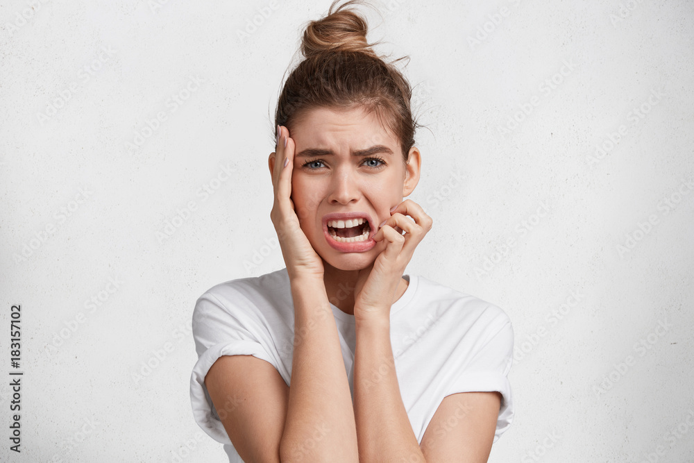 Sorrorful displeased attractive female model frowns face, going to cry ...