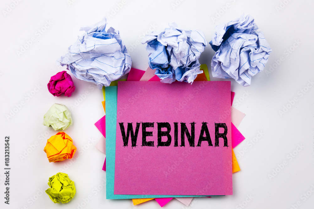 Writing text showing Webinar written on sticky note in office with ...