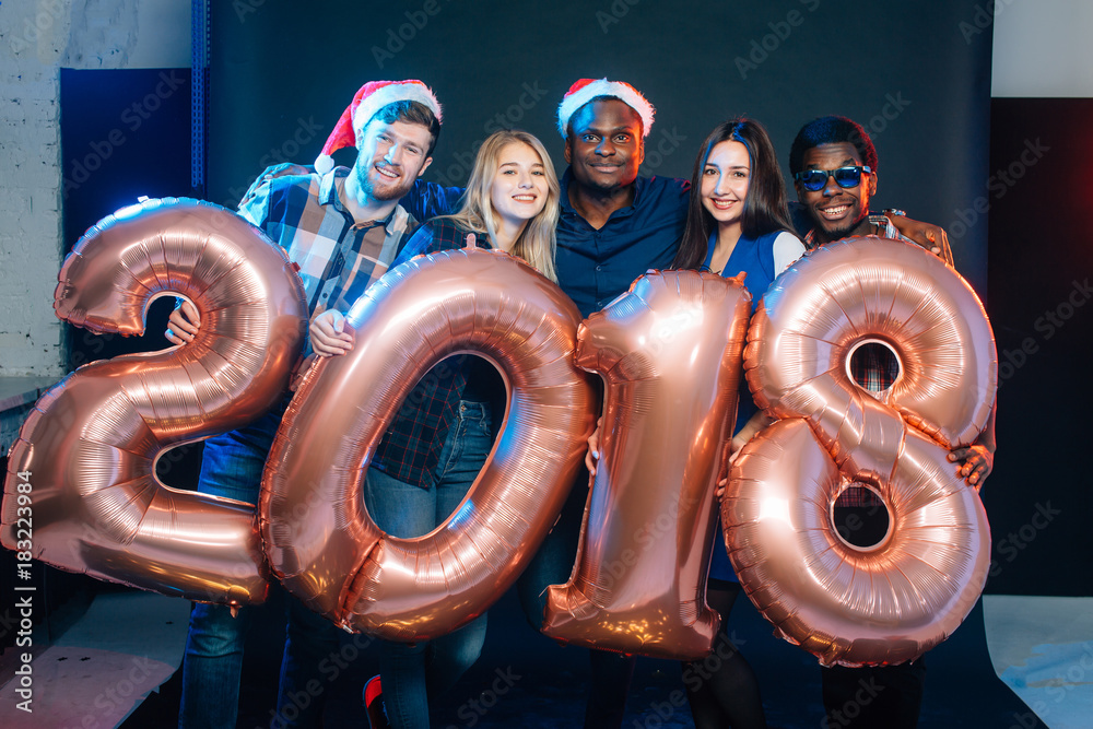 Office christmas party. Group of joyful colleagues having fun at new ...