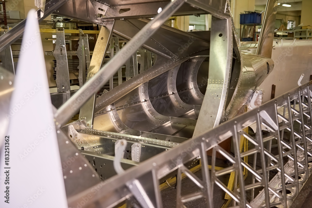 Light aircraft body part. Stainless steel, airplane production. Stock ...