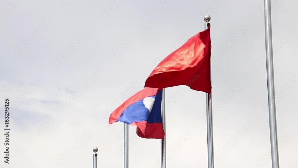 Lao National Flag with red flag with communist symbols of a sickle with ...