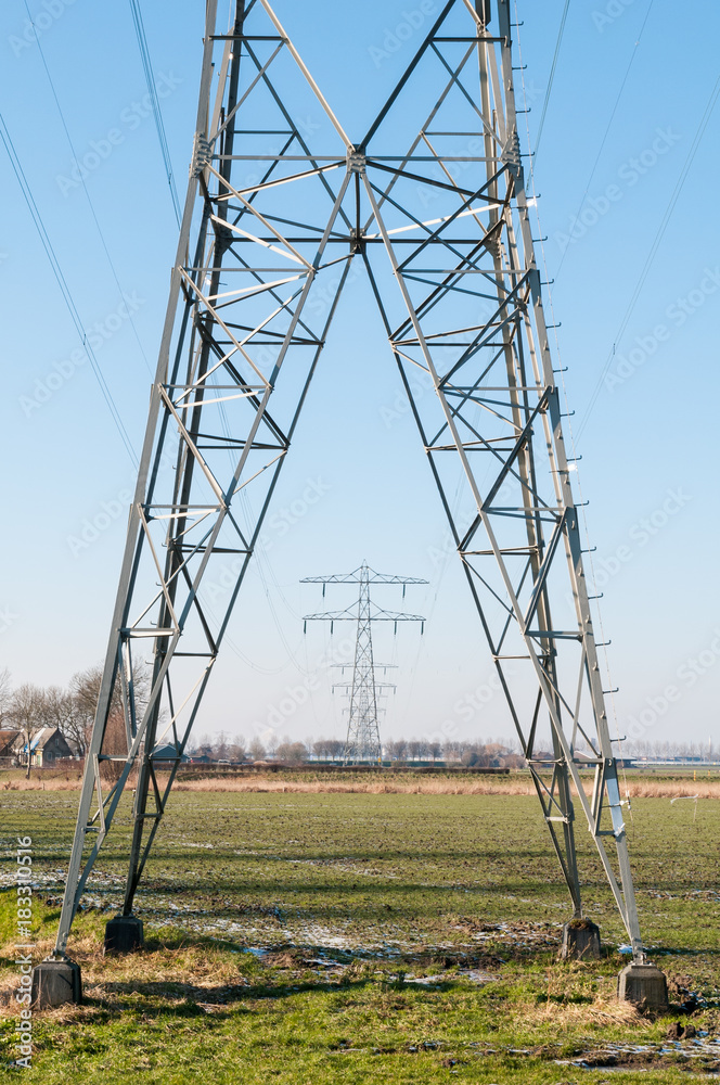 High voltage power posts in the countryside Stock Photo | Adobe Stock