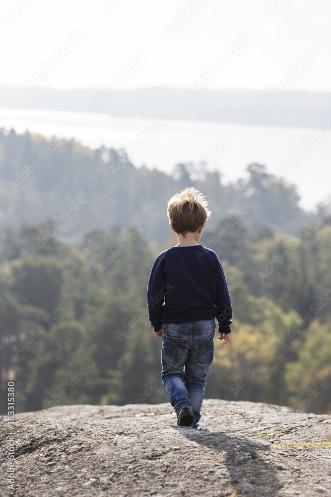Boy walking Stock Photo | Adobe Stock