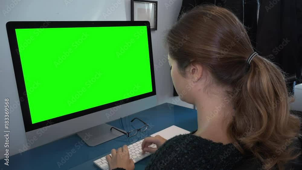 Woman Typing On Green Screen Computer, Shot Behind Model Shoulders ...