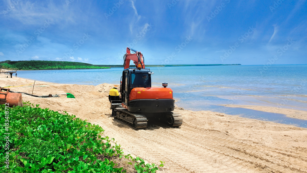 digger moving beach sand after erosion Stock Photo | Adobe Stock