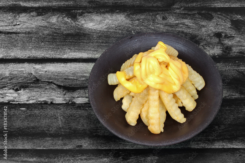 Volcano French fries as French fries topped with cheese arranged is ...