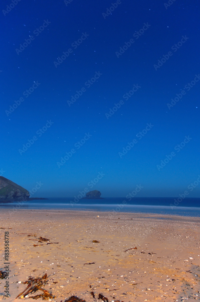 Gull rock under the starry night sky, Portreath beach, Cornwall ...
