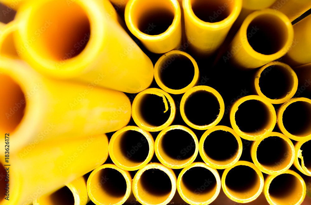 Yellow PVC tubes in storage, Plastic tubes, Background of PVC,Water ...