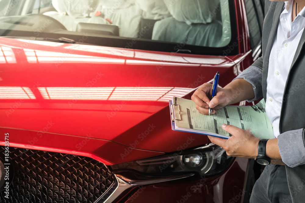 man writing on notepad or book, paper with car on wood background ...