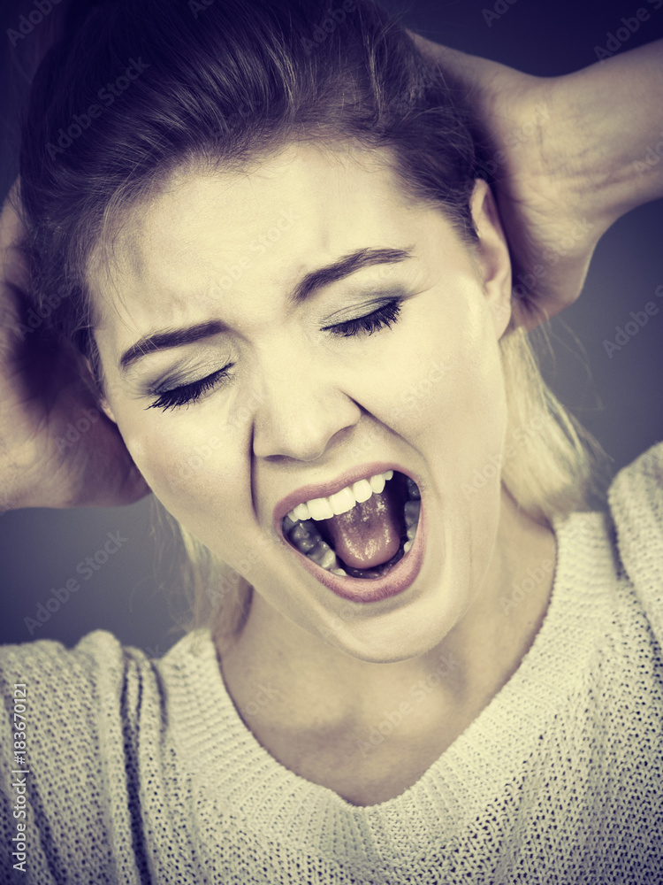 Unhappy woman screaming and yelling in pain Stock Photo | Adobe Stock