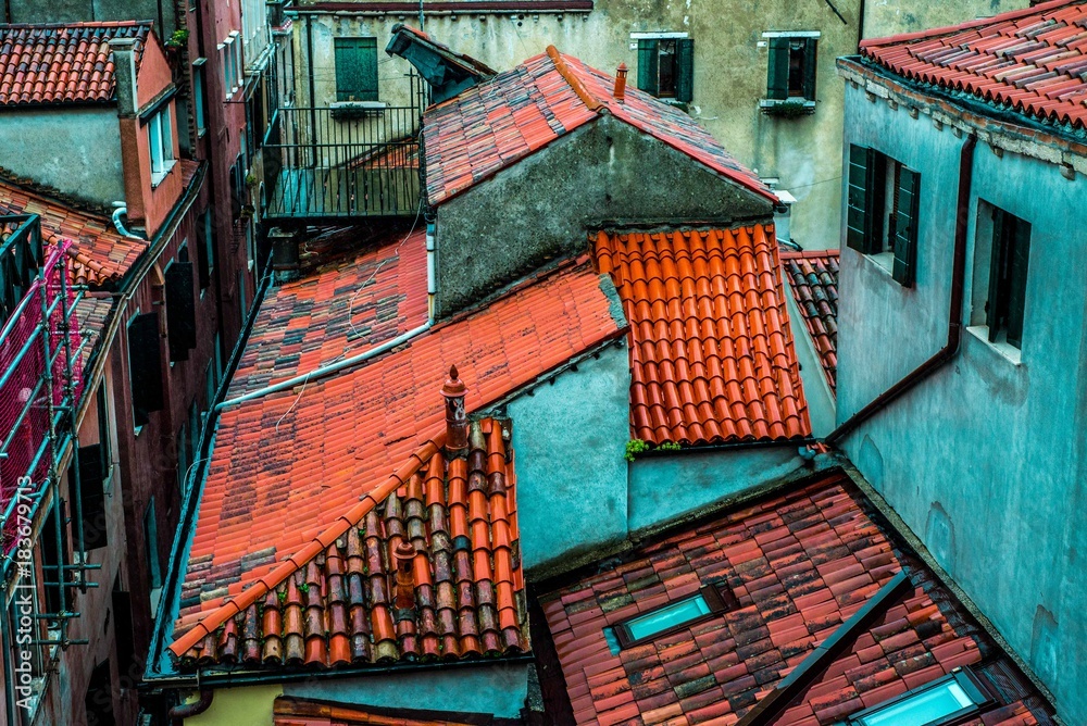 Beautiful red tiles roofs. Old buildings in Venice. Old European houses. Italian houses. Red ...