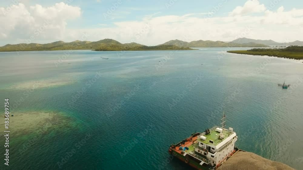 Vidéo Stock Cargo and passenger port with barges and cargo ships on ...