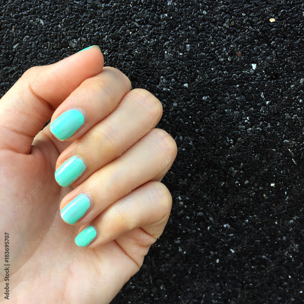 Green Manicure Nail. Beautiful Female’s Hand Nails Polish on the ...